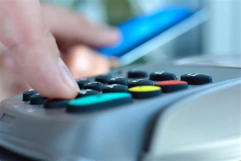 Premium Photo Finger Dials Pin Code On Terminal