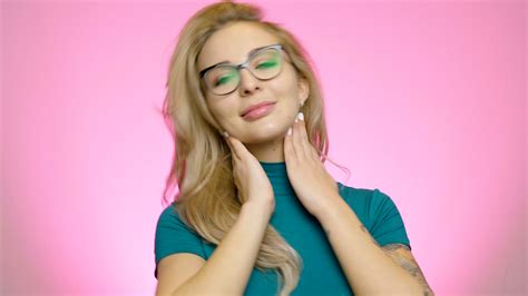 Blond Woman With Glasses Poses To The Camera Free Stock Video