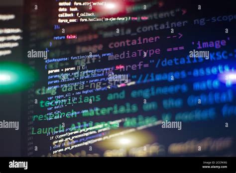 Programmer Working In A Software Develop Company Office Digital Binary Data On Computer Screen