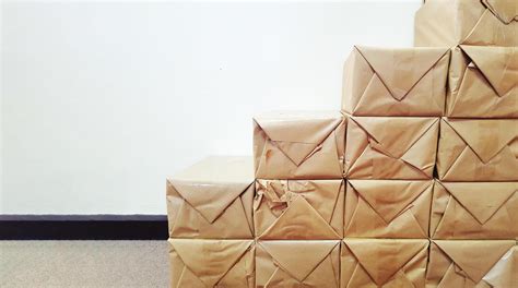 Many Stack Of Brown Package Boxes On White Wall Background With Copy
