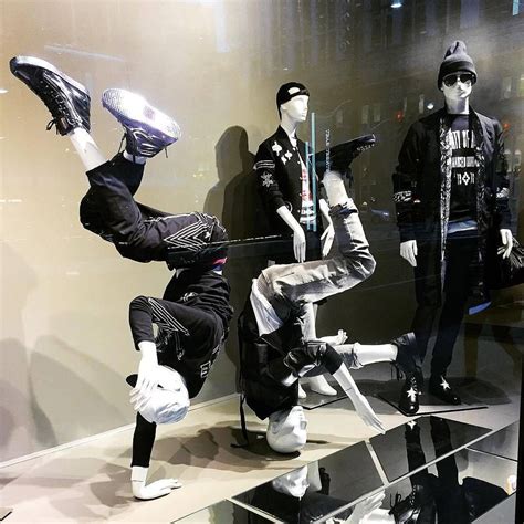 Window Display Showing Abstract White Male Mannequins In Street Wear