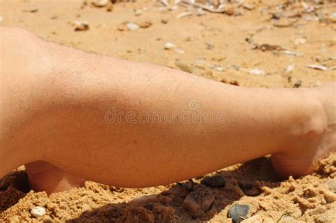 On A Beach In Greece A Woman Proudly Displays Her Natural Hairy Legs