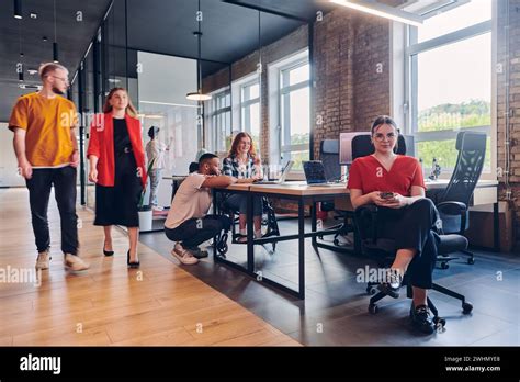 A Diverse Group Of Business Professionals Collaborates In A Modern