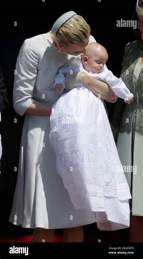Prince Albert Ii Of Monacos Wife Princess Charlene Holds One Of Her