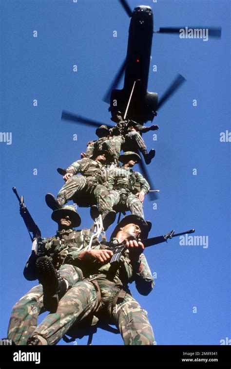 A Ch 46 Sea Knight Helicopter Lifts A Team Of Marines Off The Ground During Special Patrol