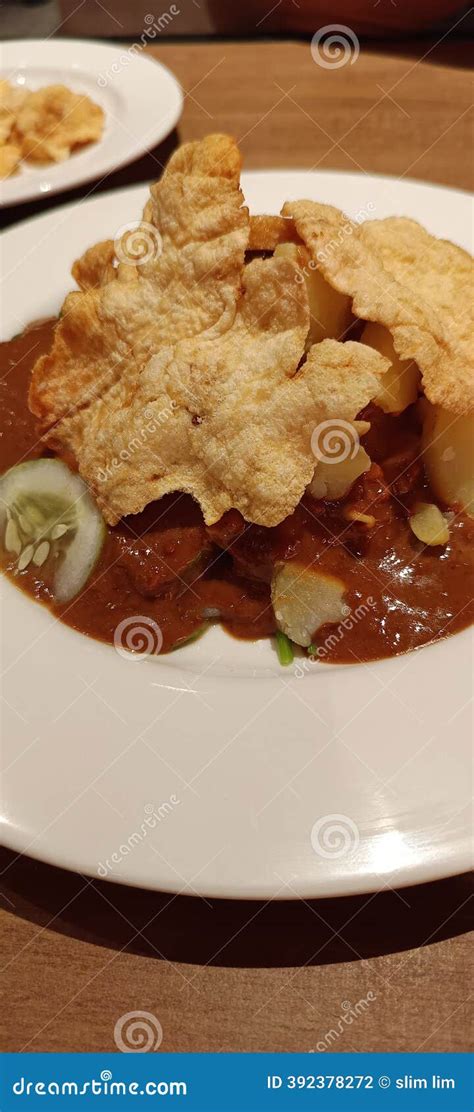 Indonesian Pecel Rice Nasi Pecel On A Banana Leaf And Rattan Plate