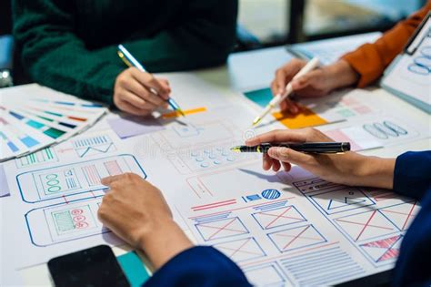 Ux Developer And Ui Designer Brainstorming About Mobile App Interface