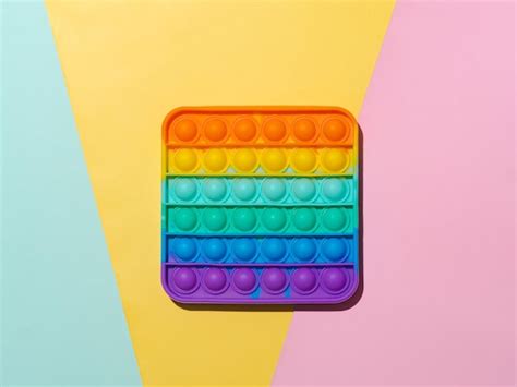 Premium Photo Popit Toy On Multicolor Background Top View
