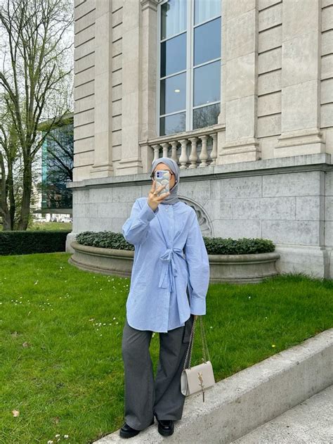Blue Shirt With A Bow Grey High Waisted Pants Ysl Bag Grey Hijab