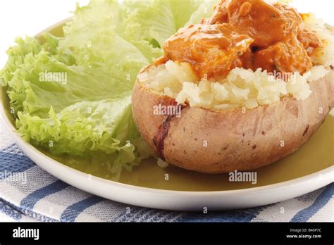 Freshly Baked Jacket Potato Filled With Indian Style Spicy Chicken
