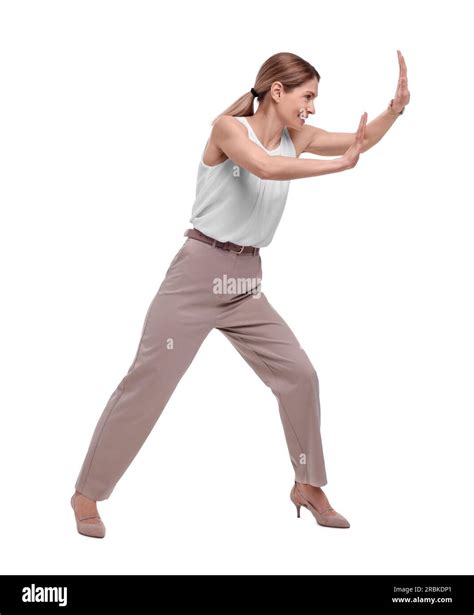 Beautiful Businesswoman Avoiding Something On White Background Stock