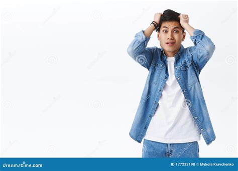 He Is In Trouble Portrait Of Alarmed Embarrassed Panicking Asian Guy Grab Head And Staring