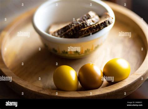 Easter Breakfast Of Colored Eggs And Grain Bread On A Beautiful Wooden
