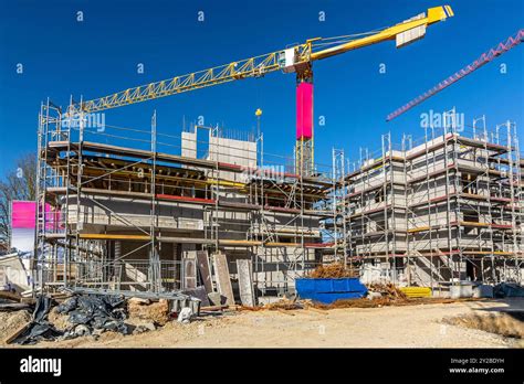 Construction Site With Crane Scaffolding And Shell Of An Unfinished