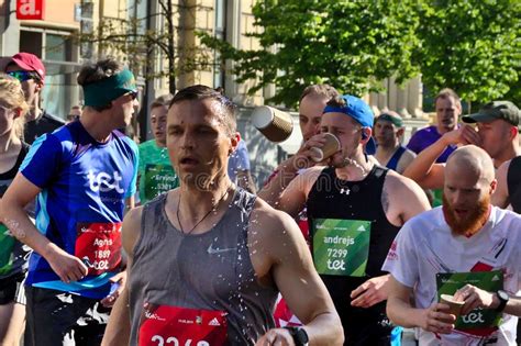 Runners Take A Water In A Marathon Race Editorial Image Image Of