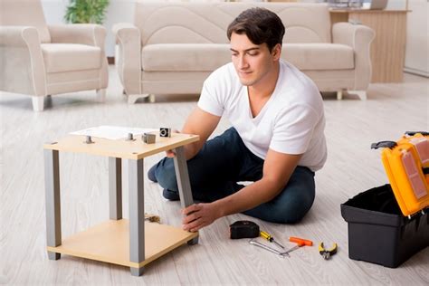 Premium Photo Man Assembling Shelf At Home