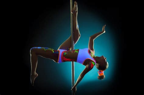 Premium Photo Graceful Pole Dancer With Uv Pattern On Body