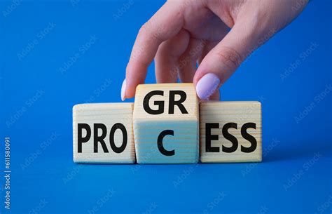 Process And Progress Symbol Businessman Hand Turns Wooden Cubes And