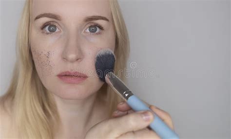 Microplastics In Cosmetics A Woman Applied A Care Cream To Her Skin