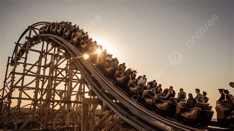 Roller Coaster Rides Over People Riding At Sunset Background Roller