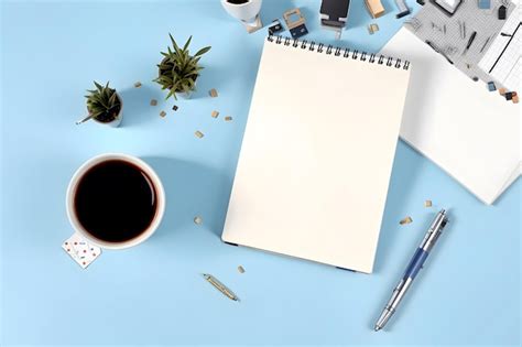 Knolling Style Shot Of Office Workspace With Empty Open Notebook Premium Ai Generated Image