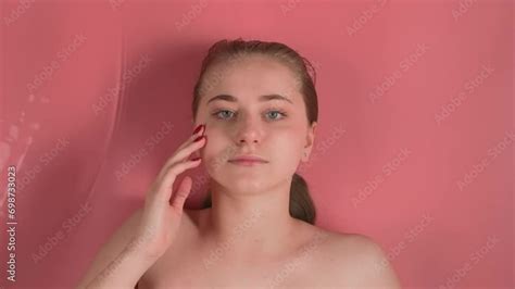 The Pink Background Shows A Young Attractive Girl Without Makeup She