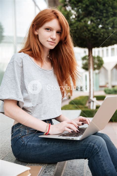 Stunning Young Woman Working On Laptop Outdoors Royalty Free Stock
