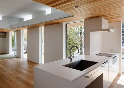 Mirrors And White Walls Draw Light Through House In Okazaki