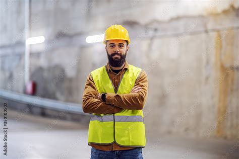 Young Smiling Attractive Construction Worker In Working Clothes
