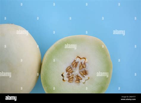 Whole And Cut Fresh Ripe Honeydew Melons On Light Blue Background Flat