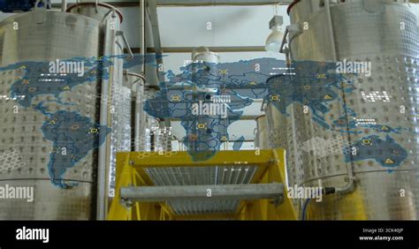 Steel Tanks Standing In Brewery With Digital World Map Overlay