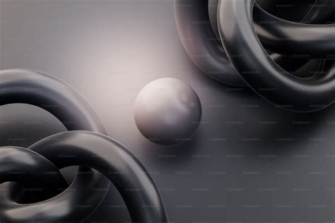 A Group Of Black And White Objects On A Gray Surface Photo 3d Image