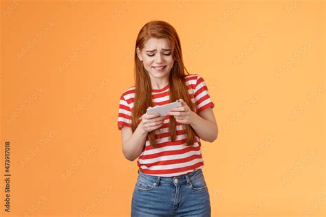 Excited Redhead Caucasian Girl Look Intense Frowning Trying Pass Hard Game Level Playing New