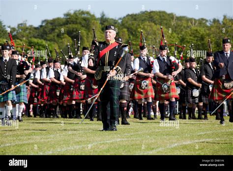 Aberdeen Uk 16th June 2013 Massed Pipe Bands March Onto The Field