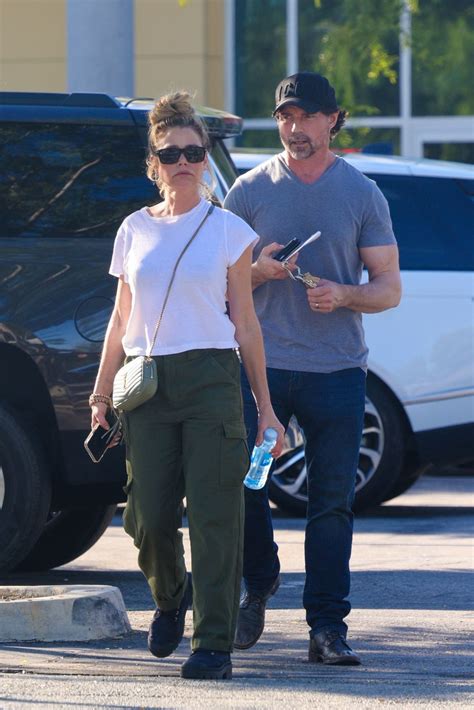 Denise Richards And Aaron Phypers Shopping At A Consignment Store In