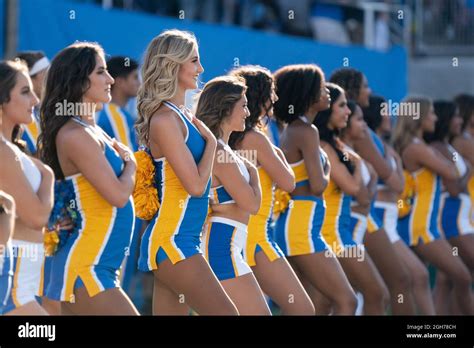 Ucla Bruins Cheerleaders During The National Anthem During A Ncaa
