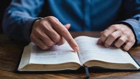 Premium Photo Closeup Shot Of A Male Pointing To A Sentence In The Bible