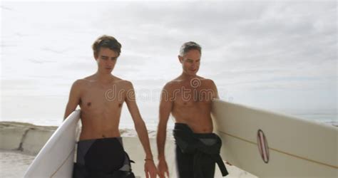 Father And Young Adult Son Enjoying Outdoor Activities Together Stock