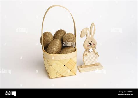Easter Composition Basket With Eggs Wrapped In Jute Twine Wooden Bunny On The Side White