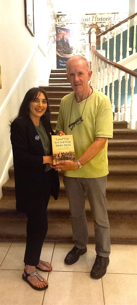 Author Gerard Orourke Presenting Historian Liz Gillis With A Copy Of His Book The Spirit Of