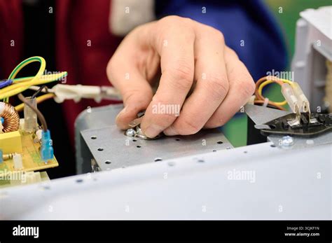 Assembly Process Of Microwave Oven Electrical Components On Conveyor