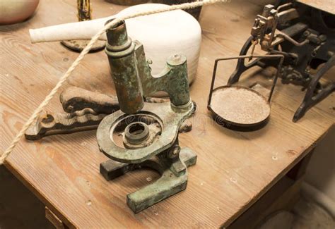 Ancient Microscope From Oxidized Metal And Other Instruments Of An