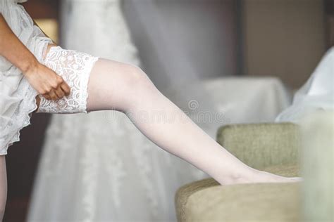 Young Woman Wearing White Stockings Laying On Her Slim Legs Stock Image