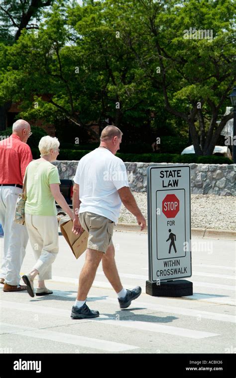 Stop Sign In Middle Of Street Allowing Pedestrians Right Of Way When