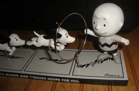 Peanuts® Snoopy And Charlie Brown Jump Through Hoops Figurine 2107806194
