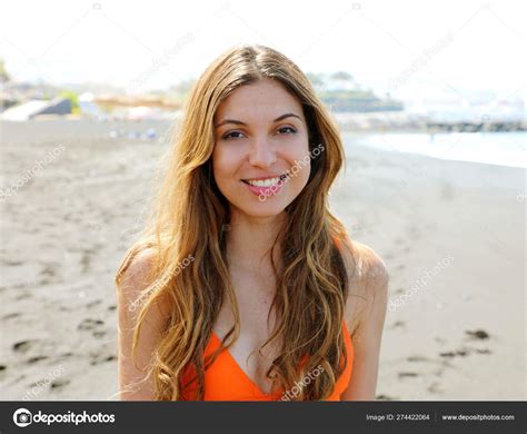 Beautiful Girl In Orange Bikini On Tropical Beach Portrait Of Happy Young Woman Smiling At Sea