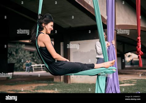 Young Caucasian Woman Winding Up Whilst Using Her Stretch Fabric As A