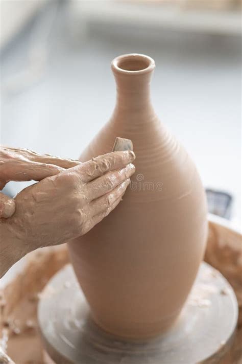 A Potter Works With A Tool On A Potterand X27s Wheel Close Up Of A Man