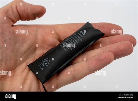 Swollen Faulty Smartphone Battery In The Hand Of Smartphone Repairman Stock Photo Alamy