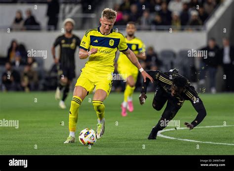 Nashville Sc Forward Sam Surridge 9 Beats Defender Lafc Defender Jesús Murillo 3 During A